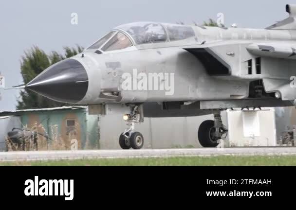 Military pilot and navigator weapons officer of a fighter jet plane ...