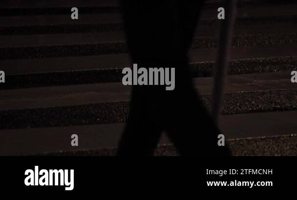 Body parts of walking people on the street in Shinjuku at night rainy ...