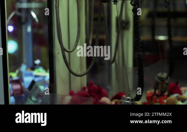 Crane Toy Grabbing Machine, Claw Crane Machine Grabbing a Toy. Close Up ...