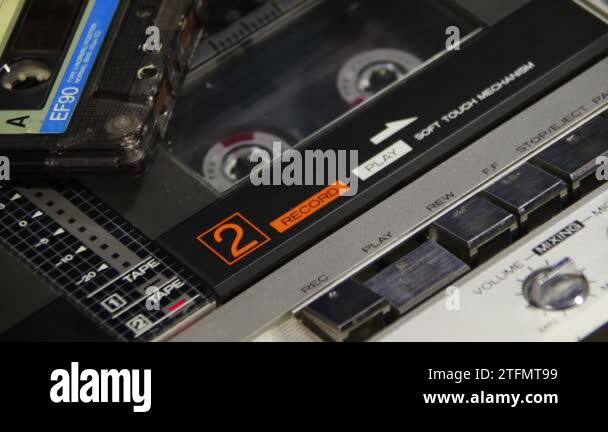 Pushing a Finger Play and Stop Button on a Two Decks Tape Recorder ...