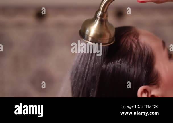 Back View Of Young Brunette Woman Taking Shower In Bathroom Washing