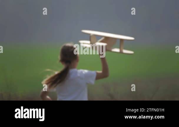 Caucasian boy playing with a model airplane. Portrait of a child with a ...