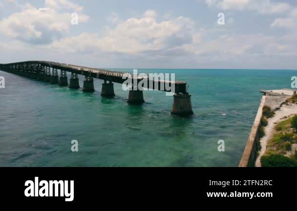 Broken bridge running over ocean surface in Florida Keys, USA. Aerial ...