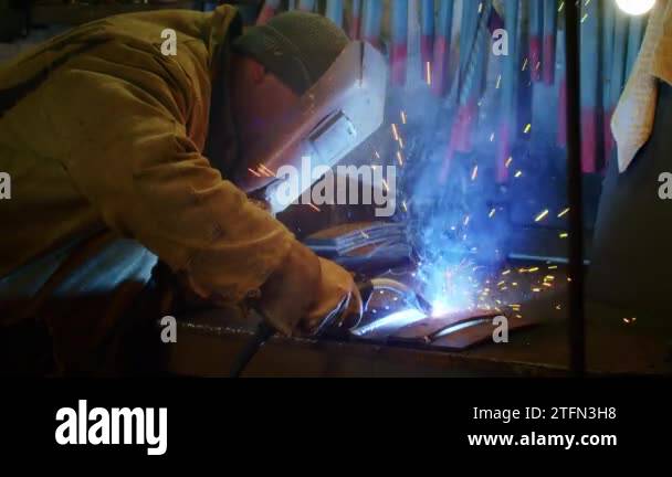 A man welds plates for body armor from springs. homemade armor plate ...
