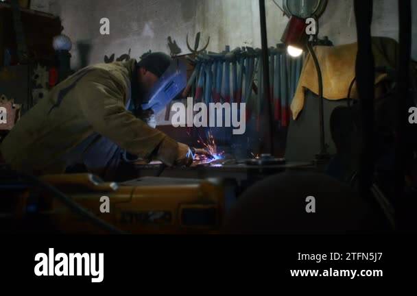 A man welds plates for body armor from springs. homemade armor plate ...