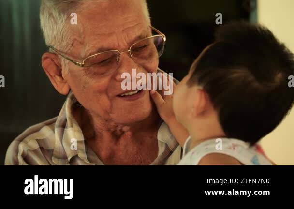 Happy Asian 80s year old great-grandfather with beautiful smile teasing ...