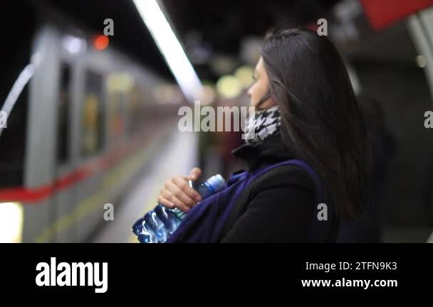 Subway metro arriving on platform. Woman about to embark inside modern ...