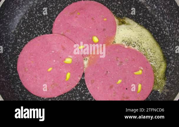 Cooking. Salami And Eggs. Cooking. slices of salami falling into the ...