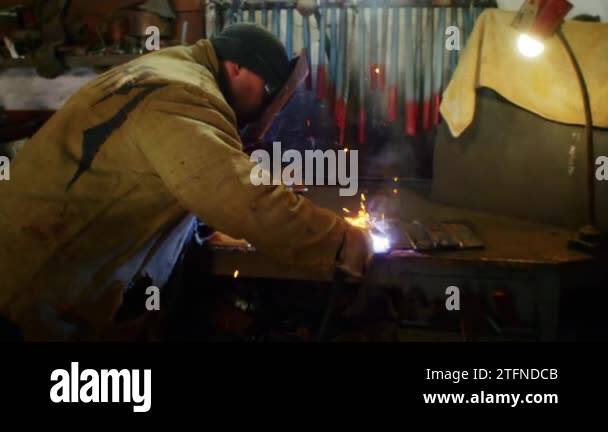 A man welds plates for body armor from springs. homemade armor plate ...