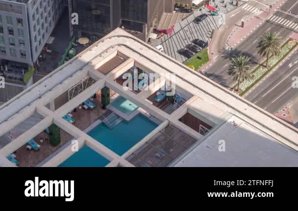 Rooftop swimming pool viewed from above timelapse, Aerial top view at ...