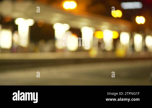 Out of focus background plate of metro rail station at night in the ...