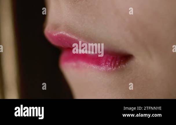 Woman lips. Woman mouth bites lip. Red lipstick on fashion model lips ...