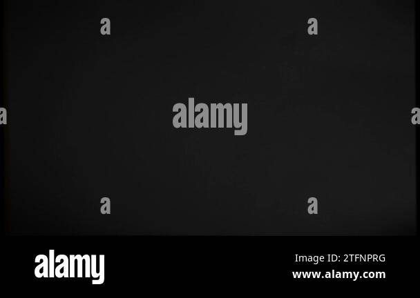 Damaged vintage film effect. Black background with flickering ...