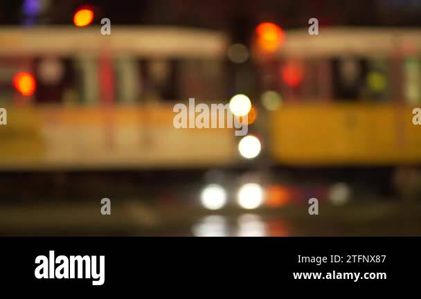 Out of focus background plate of passing light rail train downtown in ...