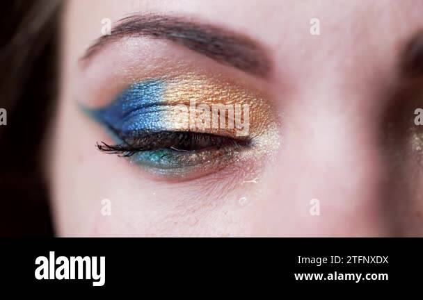 Ukrainian woman close-up, eyes crying, tears running down face. Pain ...