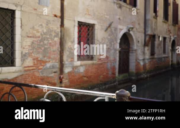 Old stone structure with weathered arches in Venice, Italy. View of ...