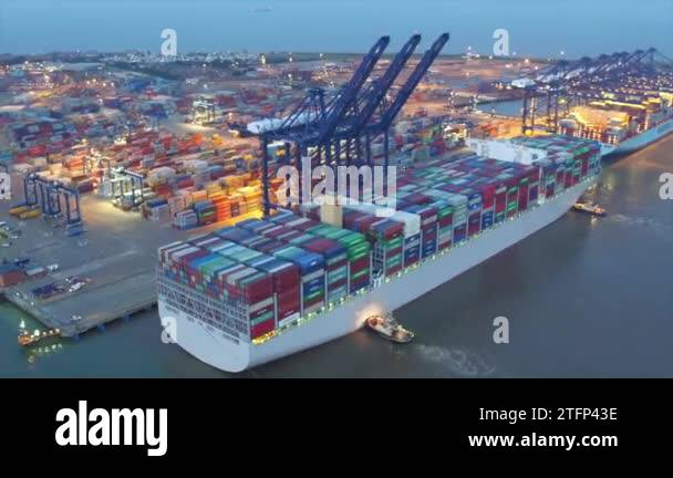 Container ship loading and in deep sea port, Aerial view of business ...