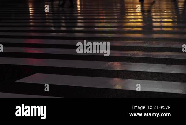 Body parts of walking people on the street in Shinjuku at night rainy ...