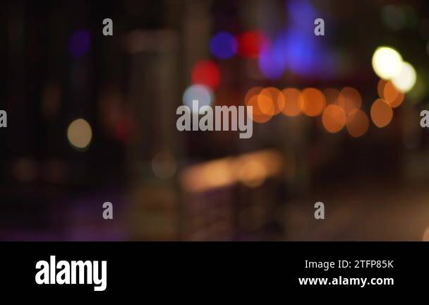 Background plate of out of focus city street sidewalk at night with ...