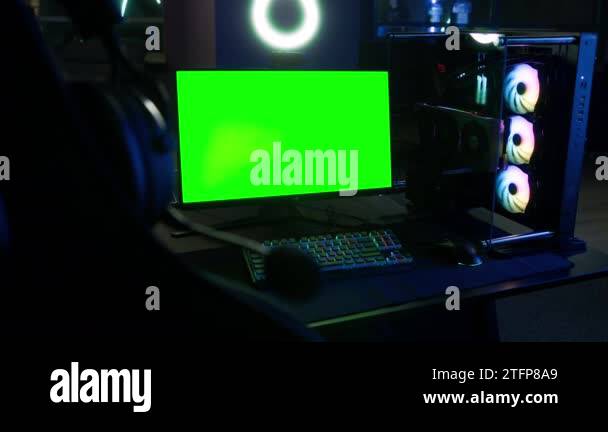 Shot of a gaming station. Computer green screen with copy space ...