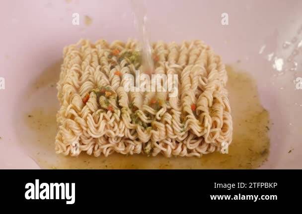Cooking instant noodles. Pour boiling water over vermicelli. The ...