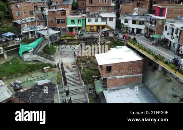 Medellin, Colombia, drone aerial view of Comuna 13 slums. Once one of ...