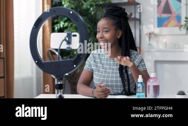 A popular influencer vlogger creates a video on social media talking ...