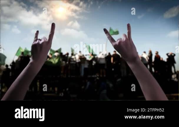 Female Hands showing Devil Horns Hand Sign at Soccer Stadium Stock ...