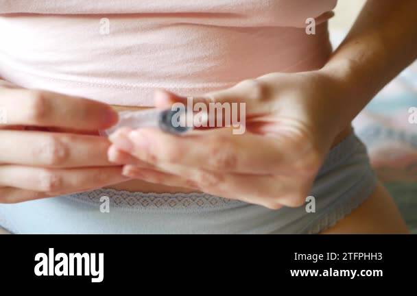 Females stomach, belly or abdomen. Woman injecting insulin, injection ...