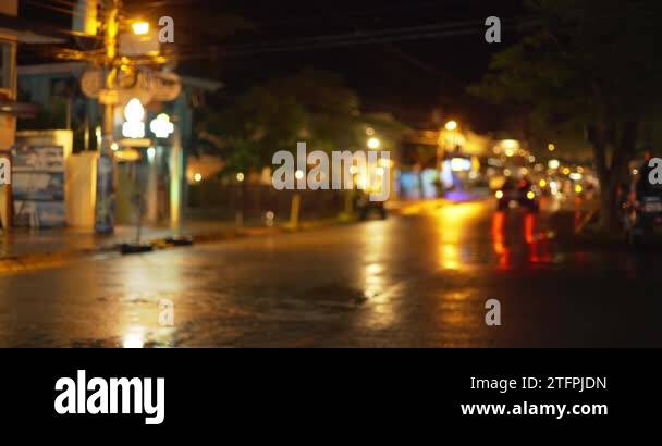 Background Plate of out of focus city street with passing traffic at ...