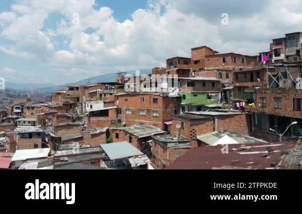 Medellin, Colombia, drone aerial view of Comuna 13 slums. Once one of ...