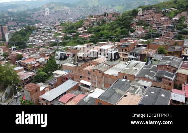 Medellin, Colombia, drone aerial view of Comuna 13 slums, favela. Once ...