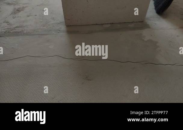 Cracks and destruction on the floor on a concrete screed Stock Video ...