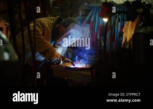 A man welds plates for body armor from springs. homemade armor plate ...