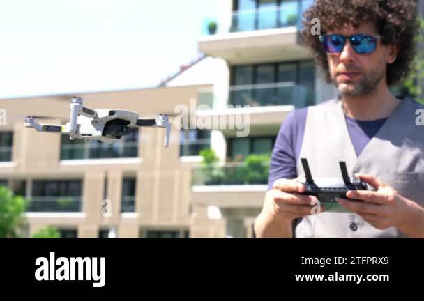Man use the drone for surveys and measurements to create a 3d virtual ...