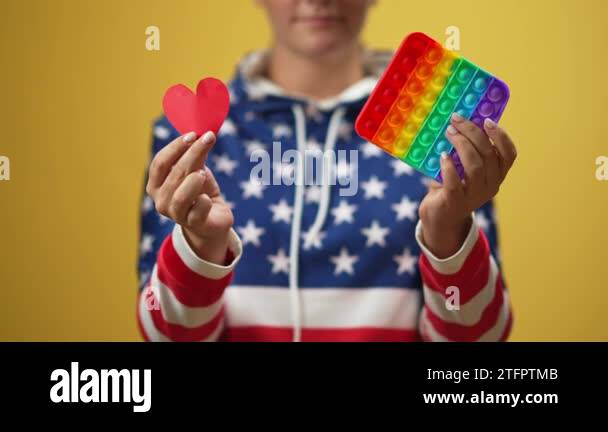 Blurred smiling woman popping dimples on colorful fidget toy in slow ...