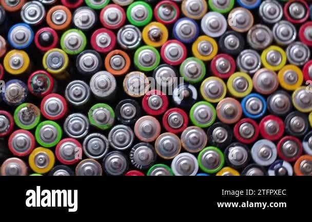 Old used batteries. Different battery tips rotate in a circle Stock ...