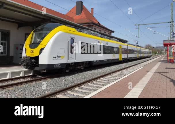 Breisach, Germany April 2022: Electric commuter train leaving the towns ...