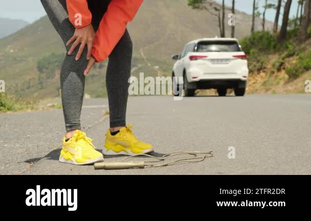 Female runner suffering with pain on sports running knee injury. Woman ...