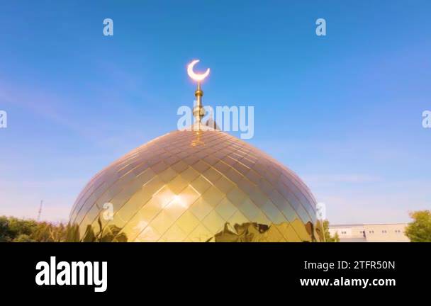 A Muslim golden dome with a crescent moon on the mosque. Minaret ...