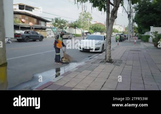 Male Street Sweeper In Reflectorized Safety Vest, Cleaning And Sweeping ...