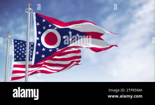 The Ohio state flag waving along with the national flag of the United ...