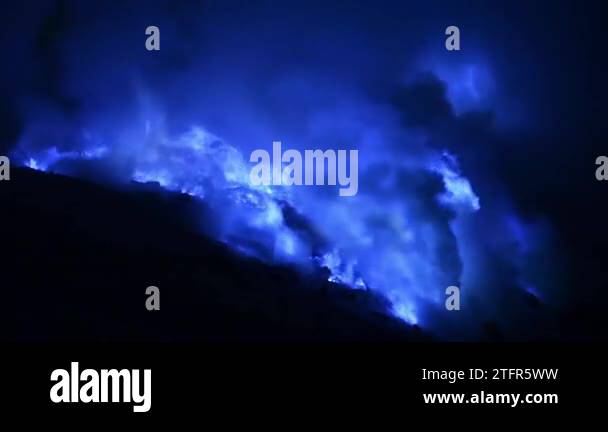 Natural phenomenon known as 'Blue fire" seen through volcanic gasses ...