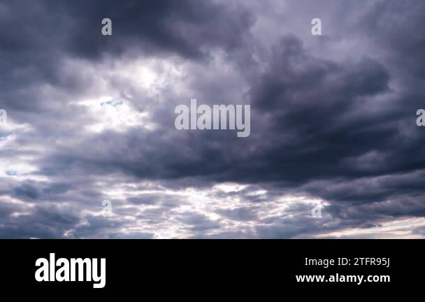 Clouds moving under the sun in the blue sky, time-lapse. Cloud space ...