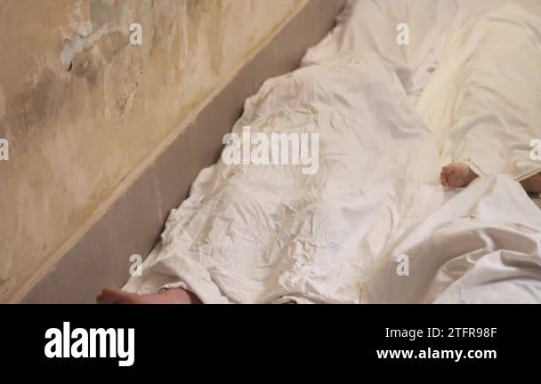 Human corpse covered with a sheet in room. Man corpse covered sheet ...
