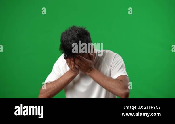 Portrait of stressed desperate Middle Eastern sportsman looking at ...
