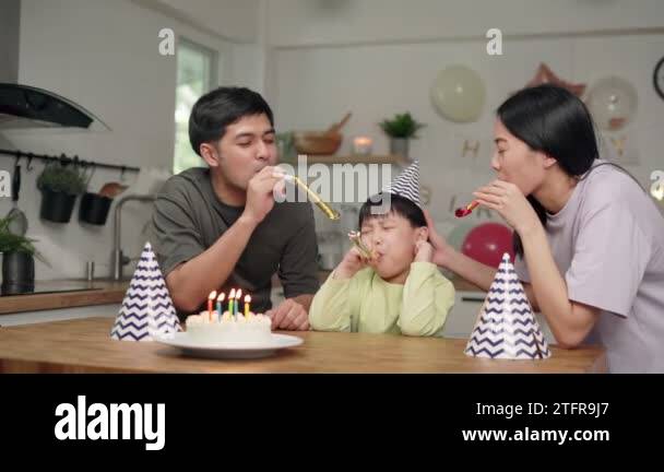 Family activities on holidays. Father and mother are hosting a birthday ...