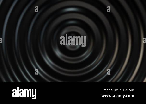 Waving oily reflective dark surface in background. Diverging circles of ...