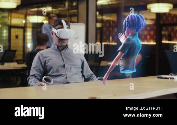 A man with virtual reality glasses uses a joystick to connect the video ...