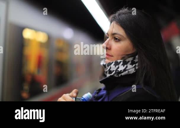 Subway metro arriving on platform. Woman about to embark inside modern ...